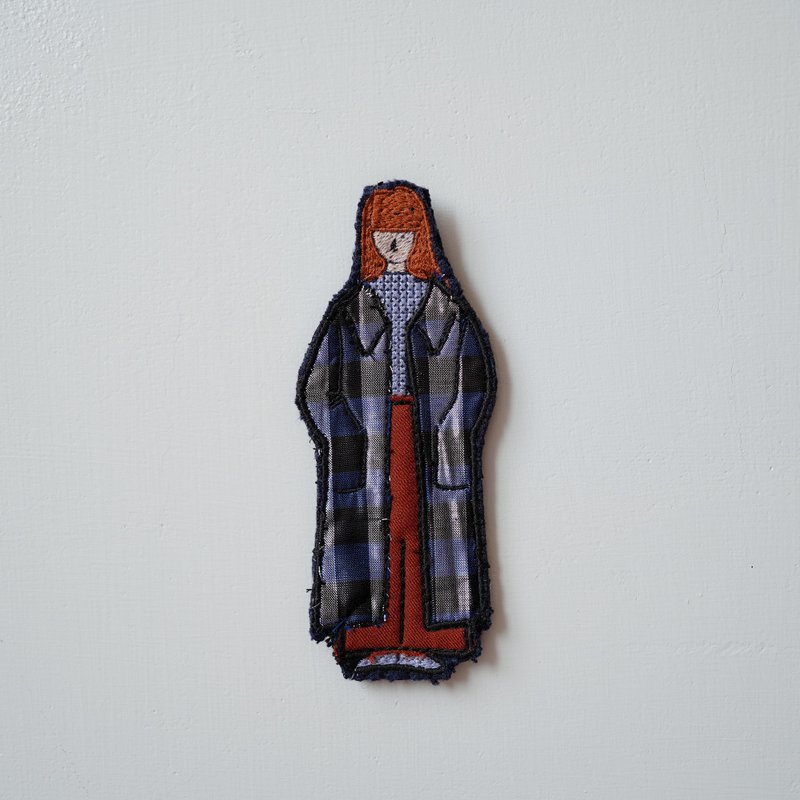 Little woman with long flowing hair, foreign character patch ...