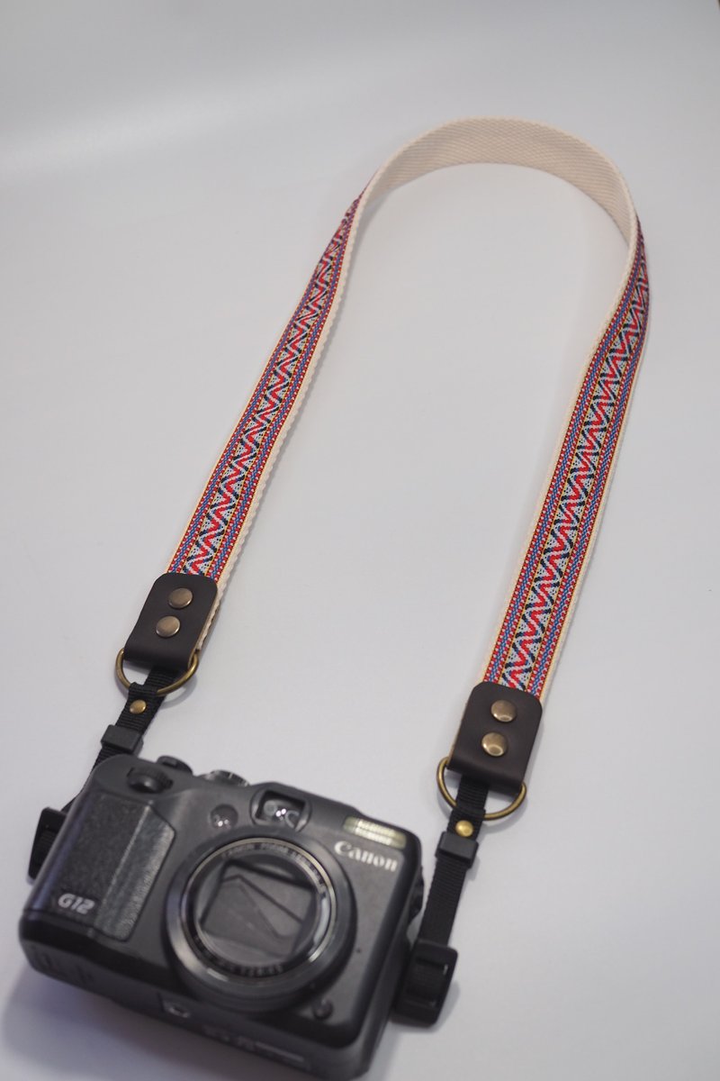The camera strap features both a native style pattern and a Bohemian ...